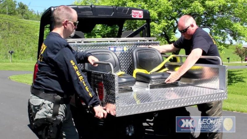 Officer Putting Seat In UTV